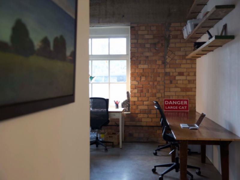 Desks in beautiful warehouse office space